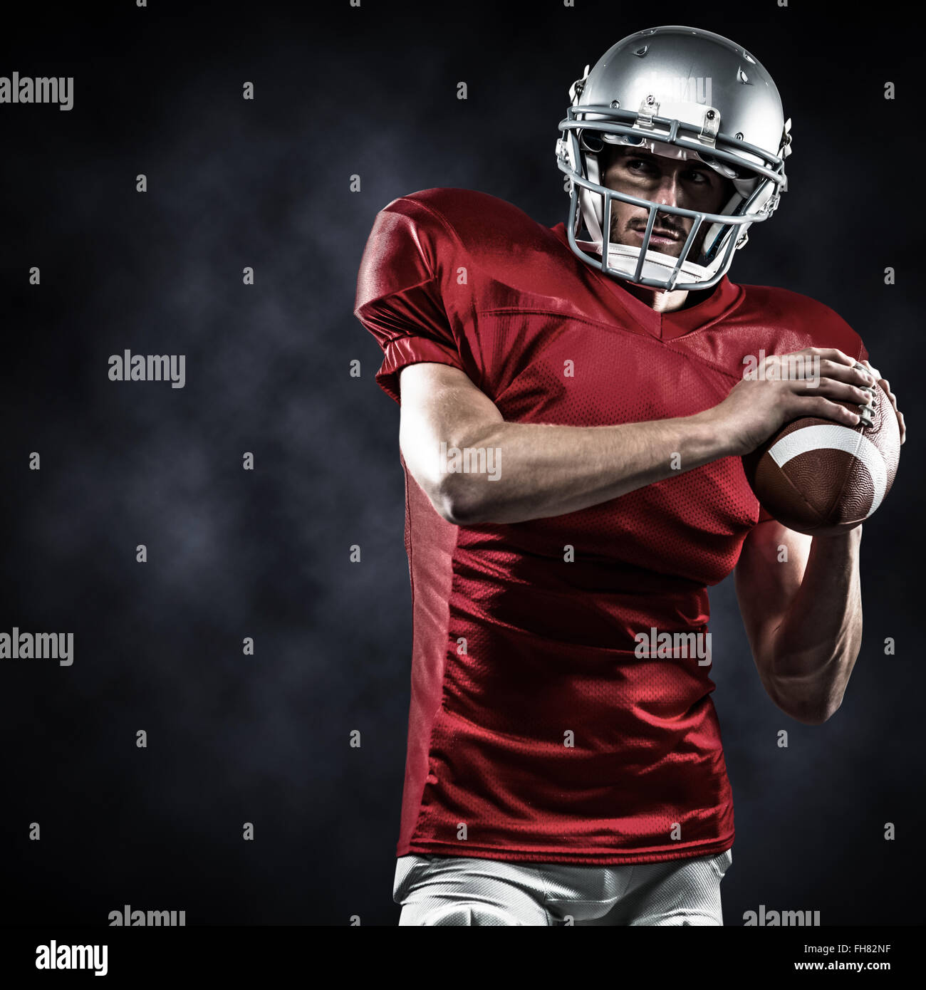Composite image of confident american football player in red jersey ...