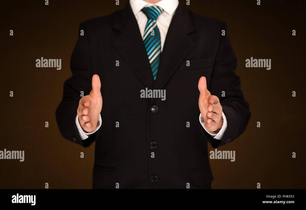 Businessman holding something Stock Photo - Alamy