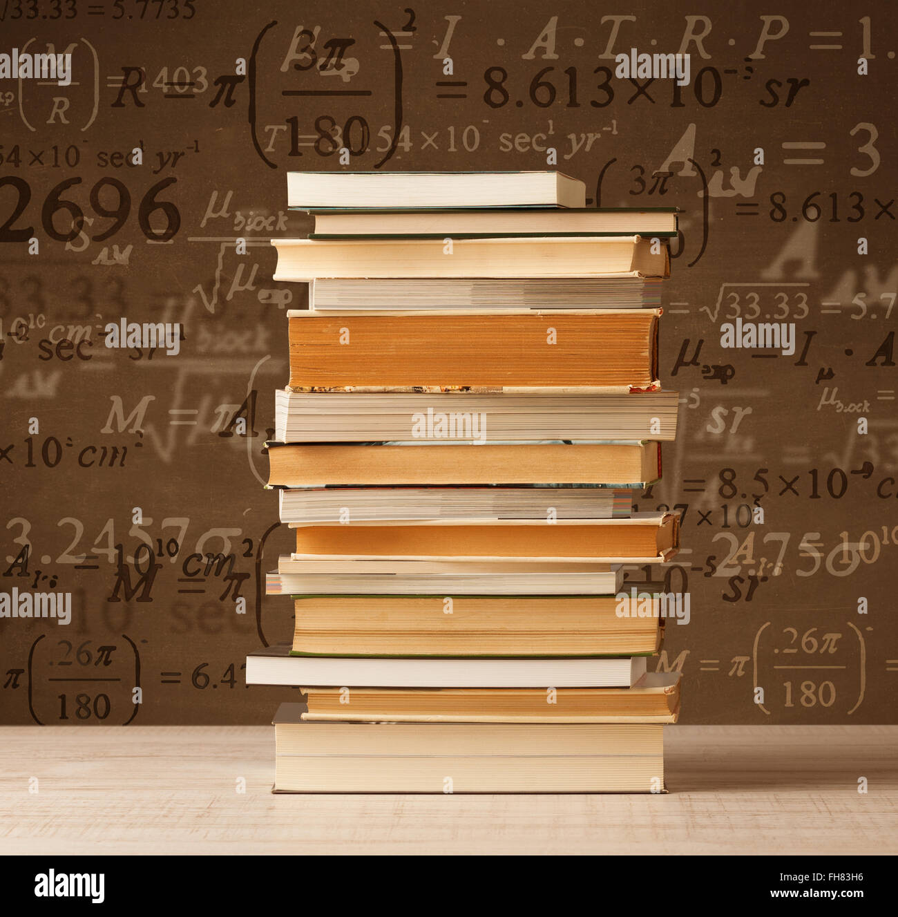 Books on vintage background with math formulas Stock Photo - Alamy