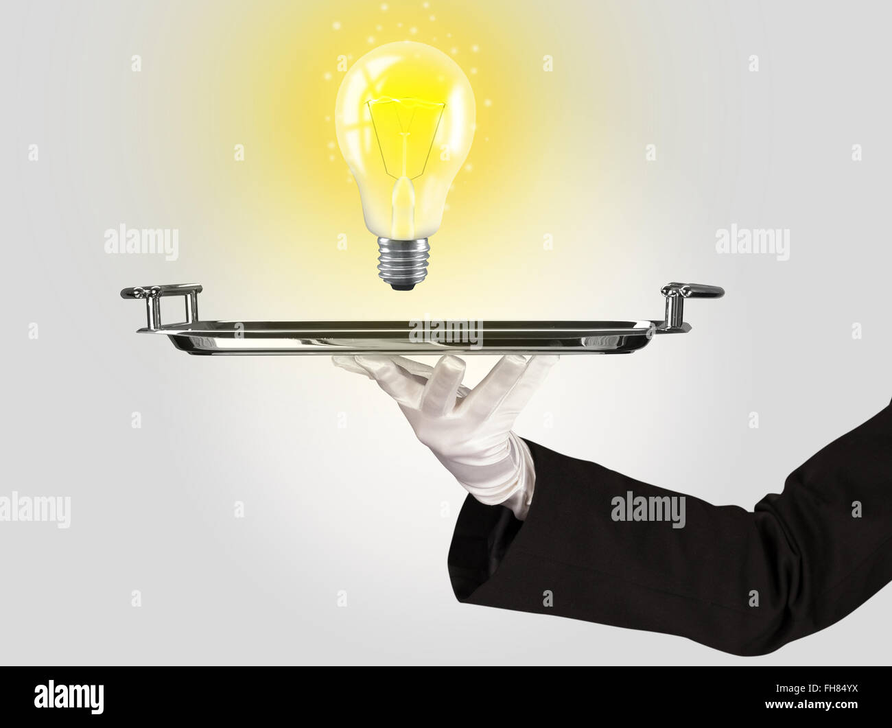 Clever idea concept with bulb on tray Stock Photo - Alamy