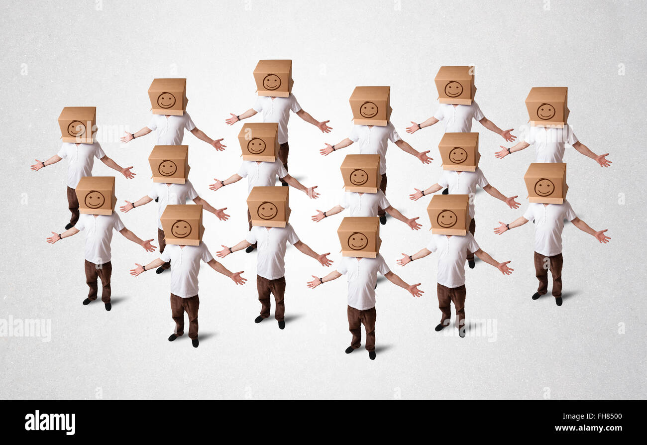 Handsome men in suit gesturing with drawn smiley faces on box Stock ...