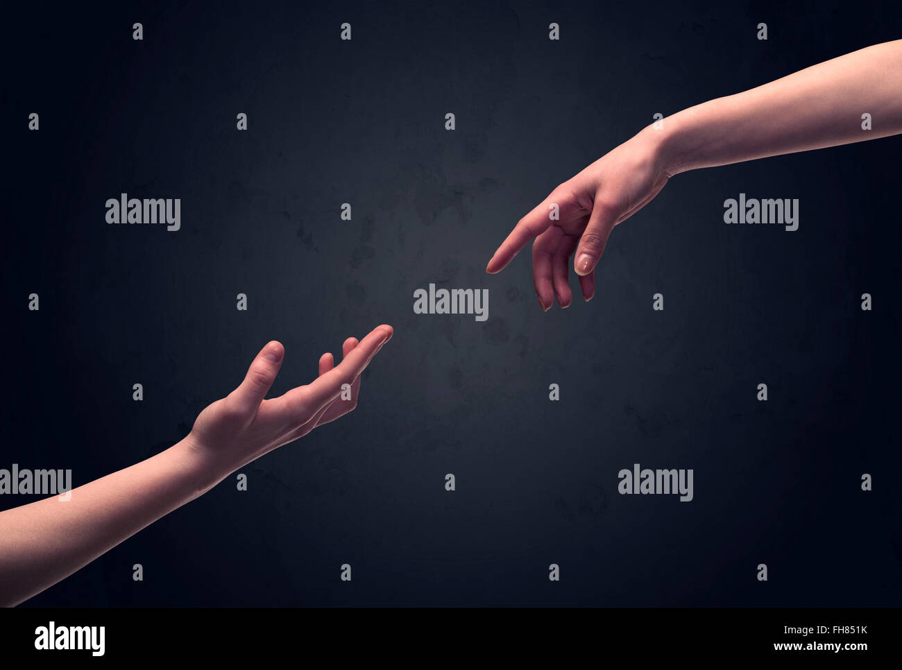 Hand about to touch another one Stock Photo - Alamy
