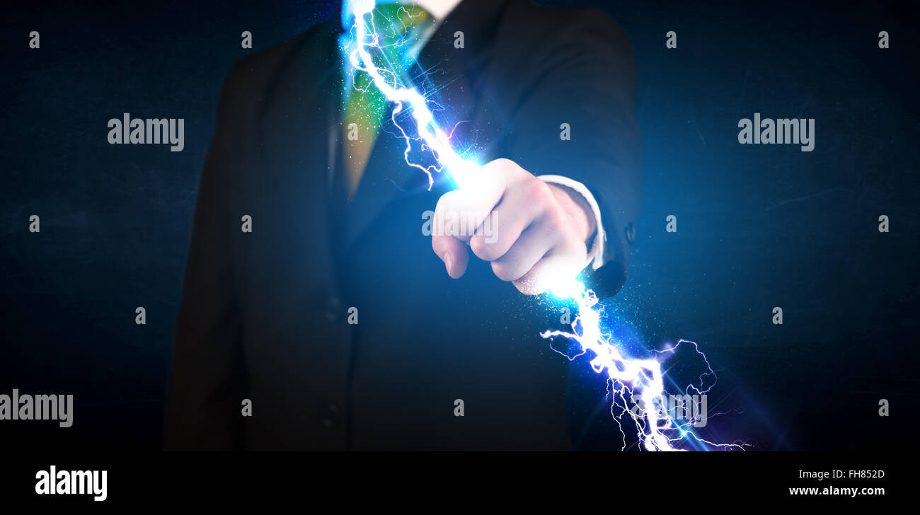 Business man holding electricity light bolt in his hands Stock Photo ...