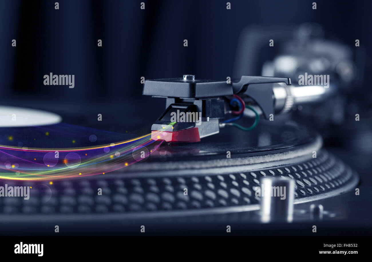 Turntable playing vinyl with glowing abstract lines Stock Photo - Alamy