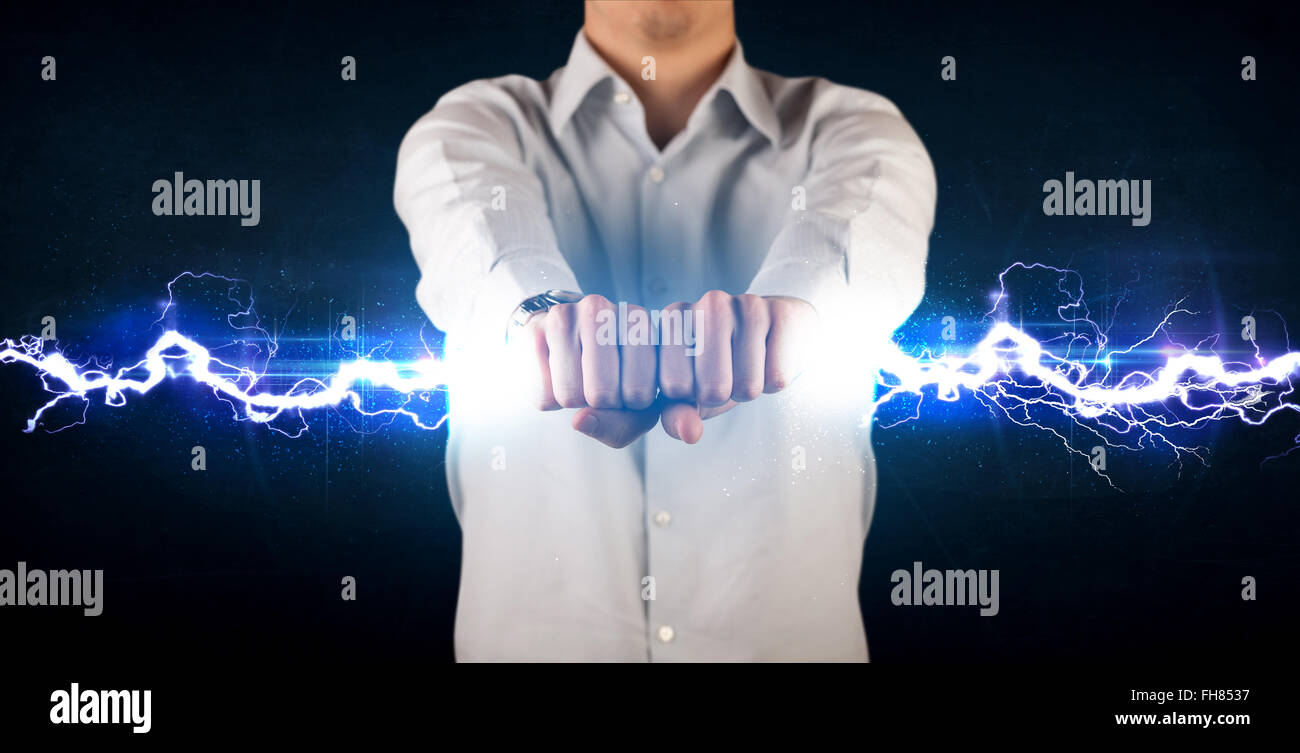 Business man holding electricity light bolt in his hands Stock Photo ...