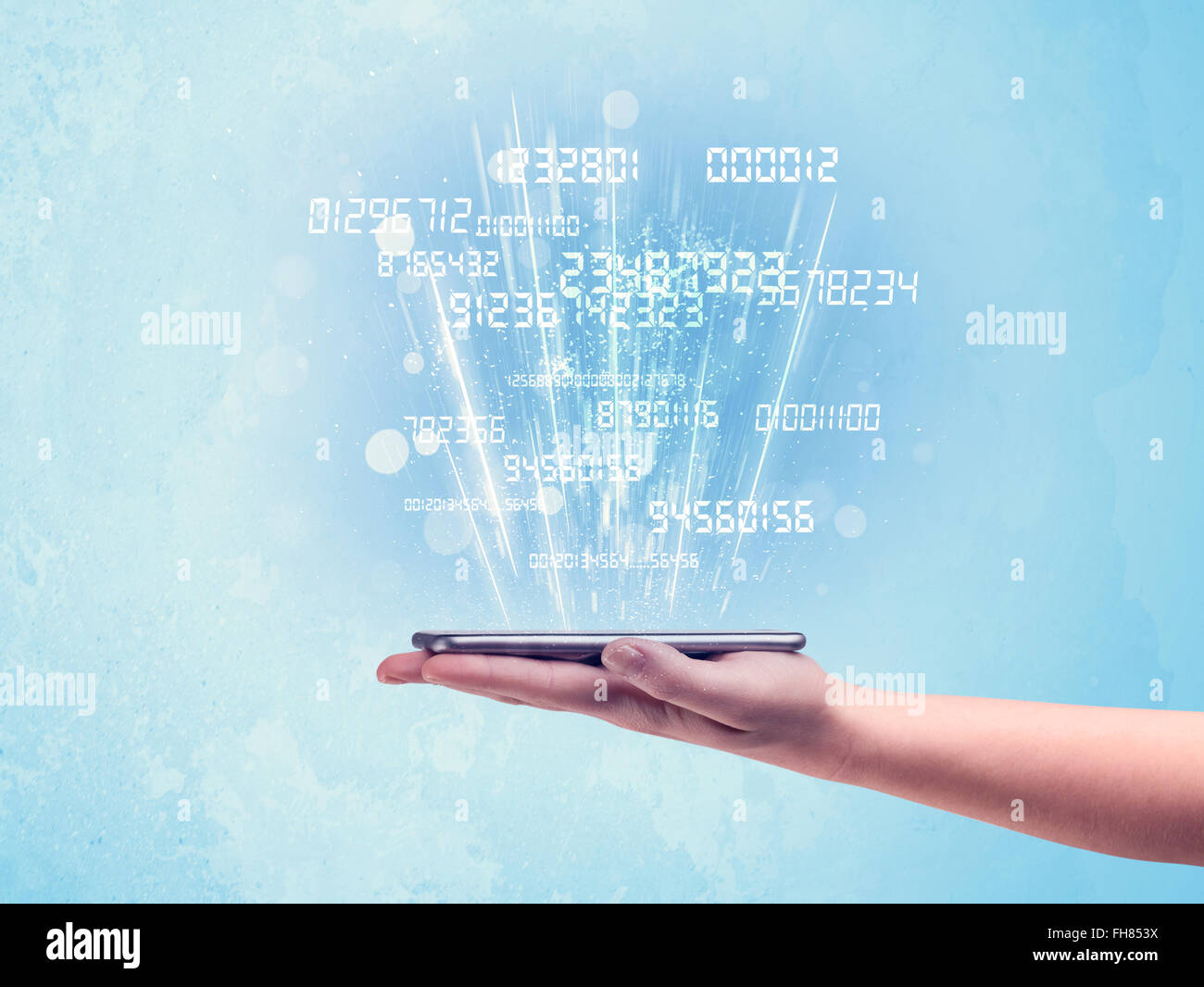 Hand holding phone with digital numbers Stock Photo - Alamy