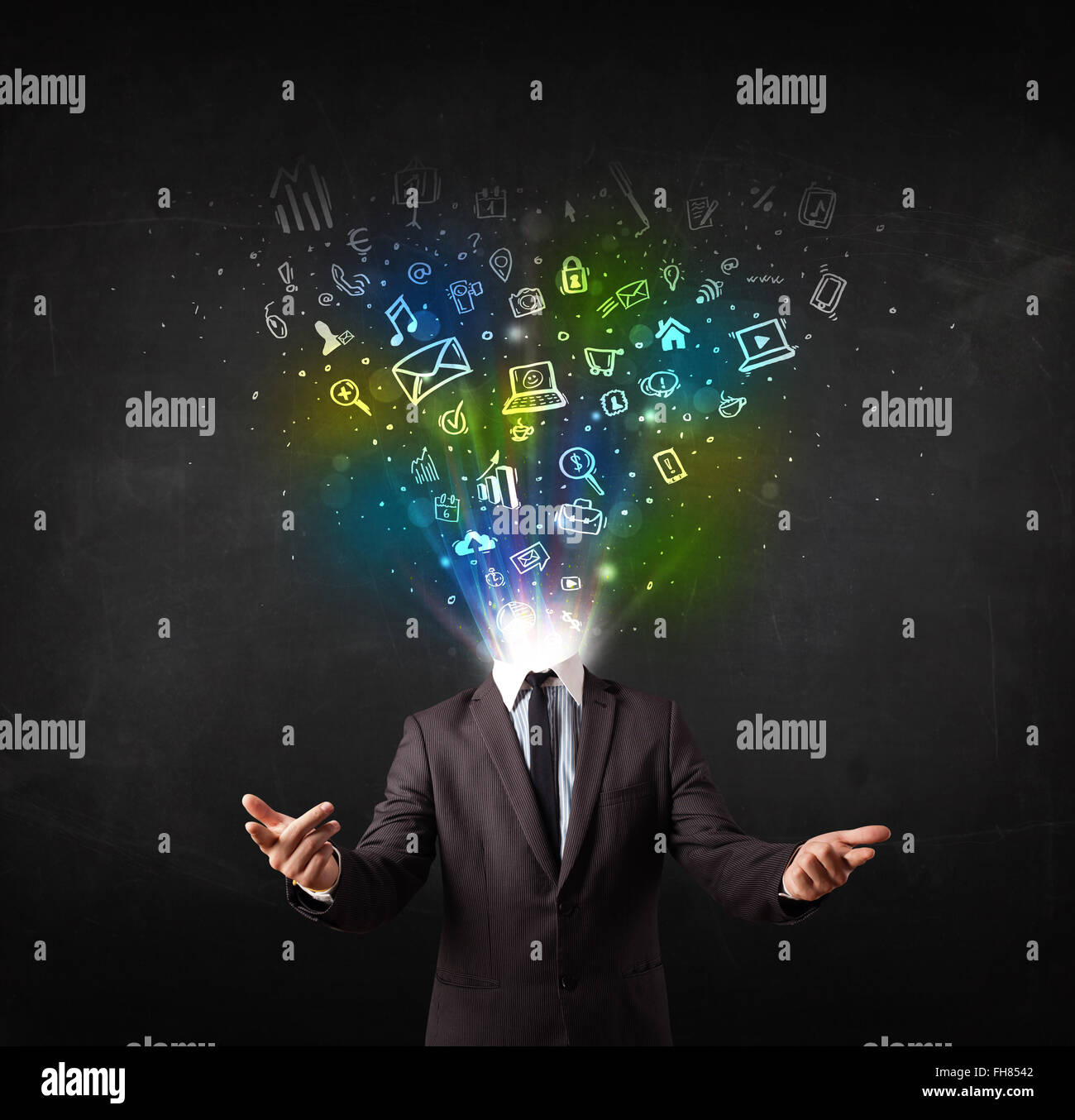 Business man with glowing media icons exploding head Stock Photo - Alamy