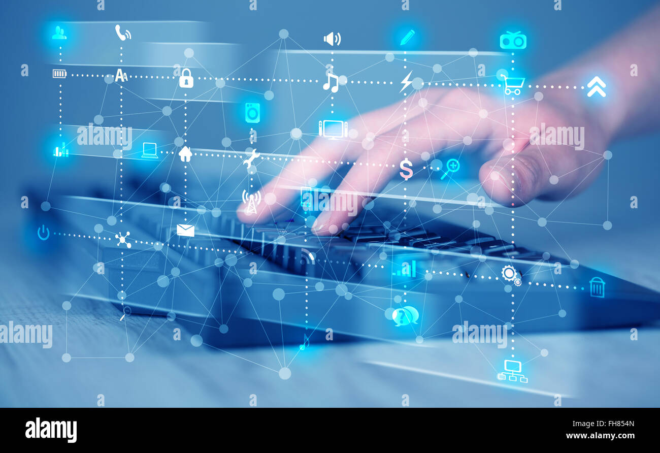 Hand pressing keyboard with high tech media icons Stock Photo - Alamy