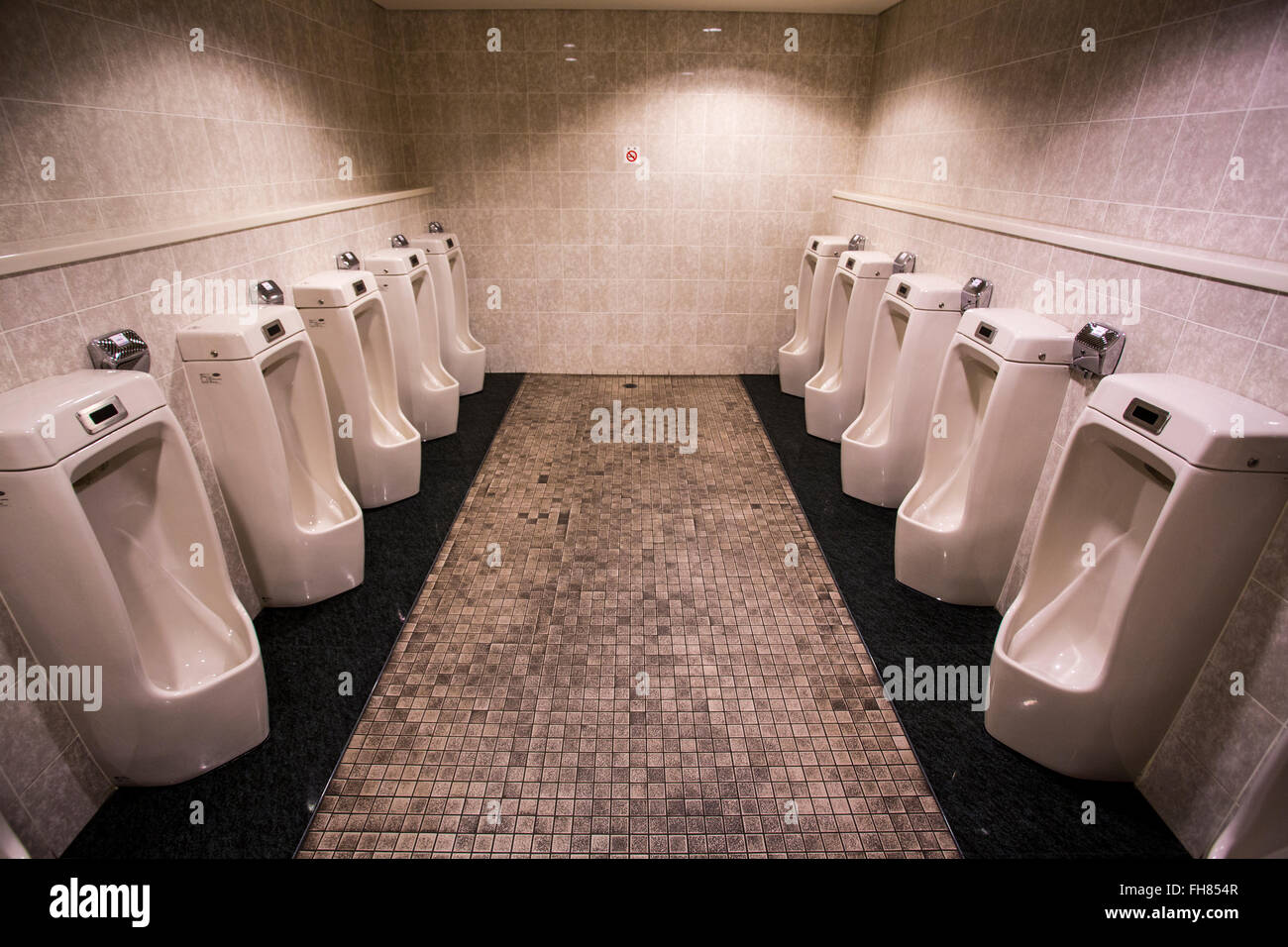 A row of urinals in a Tokyo bathroom Stock Photo - Alamy