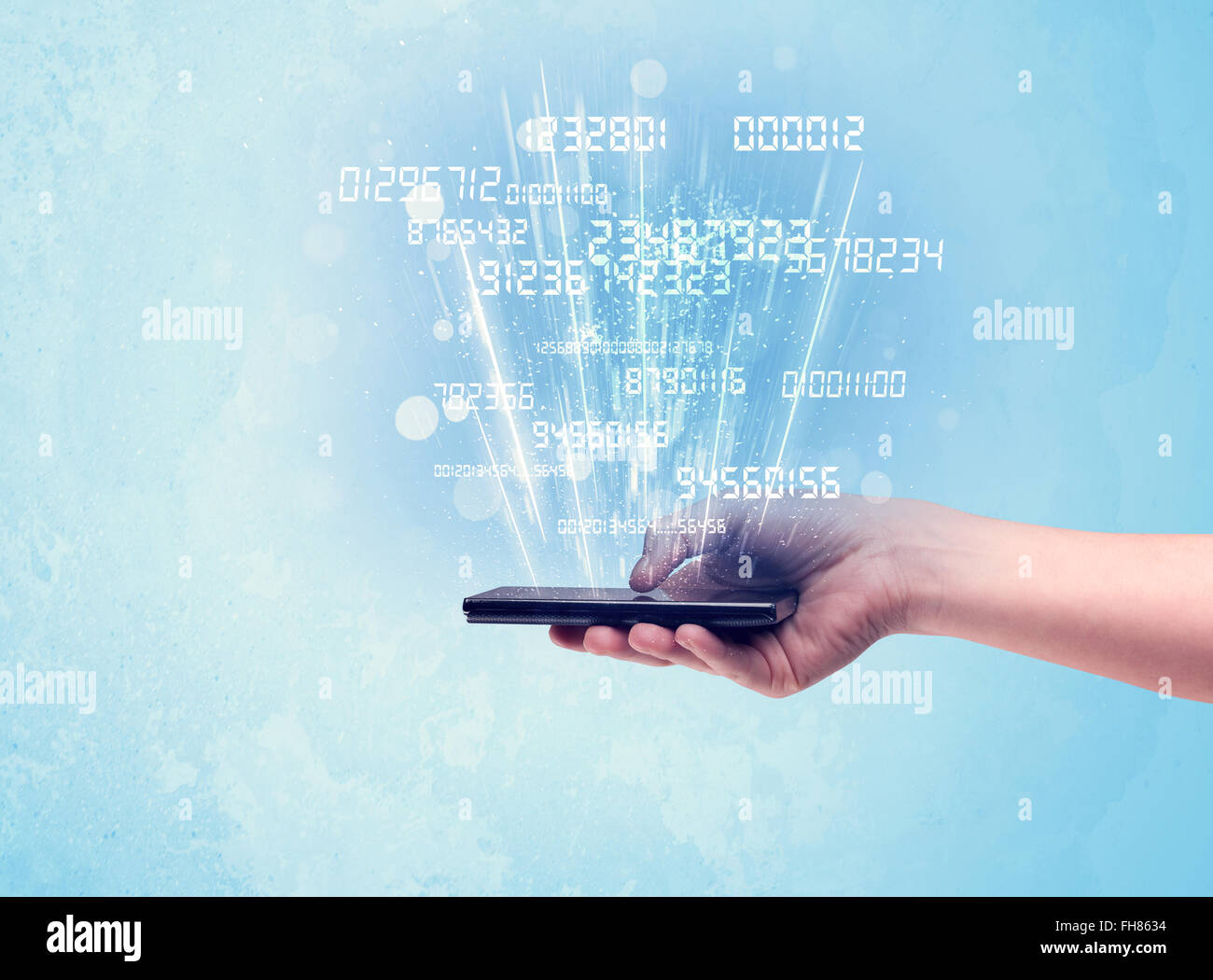 Hand holding phone with digital numbers Stock Photo - Alamy