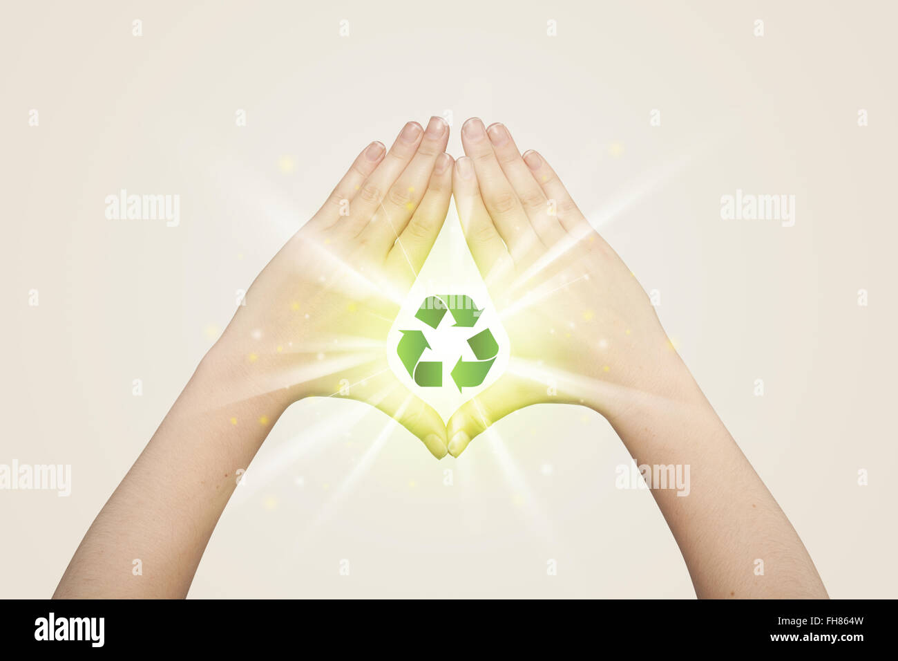 Hands creating a form with recycling sign Stock Photo - Alamy