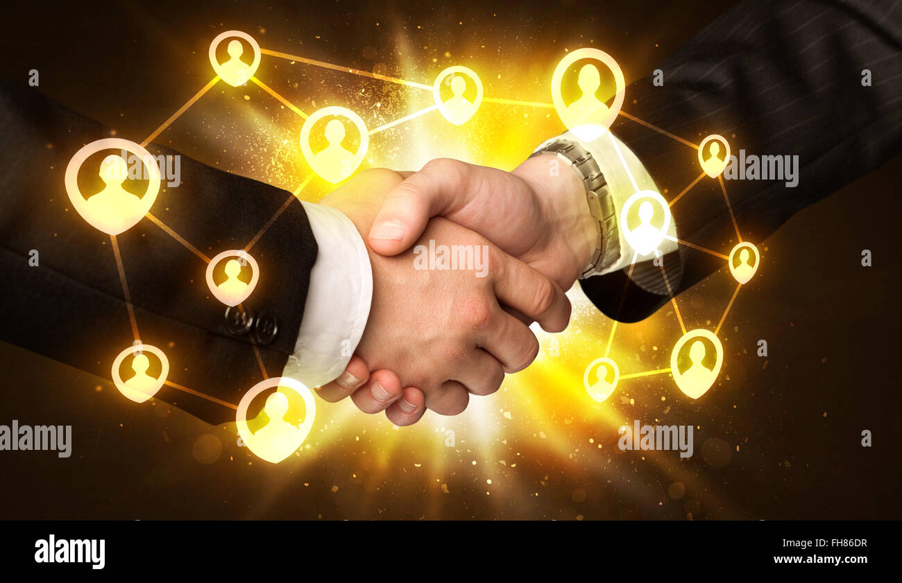 Social netwok connection handshake Stock Photo - Alamy