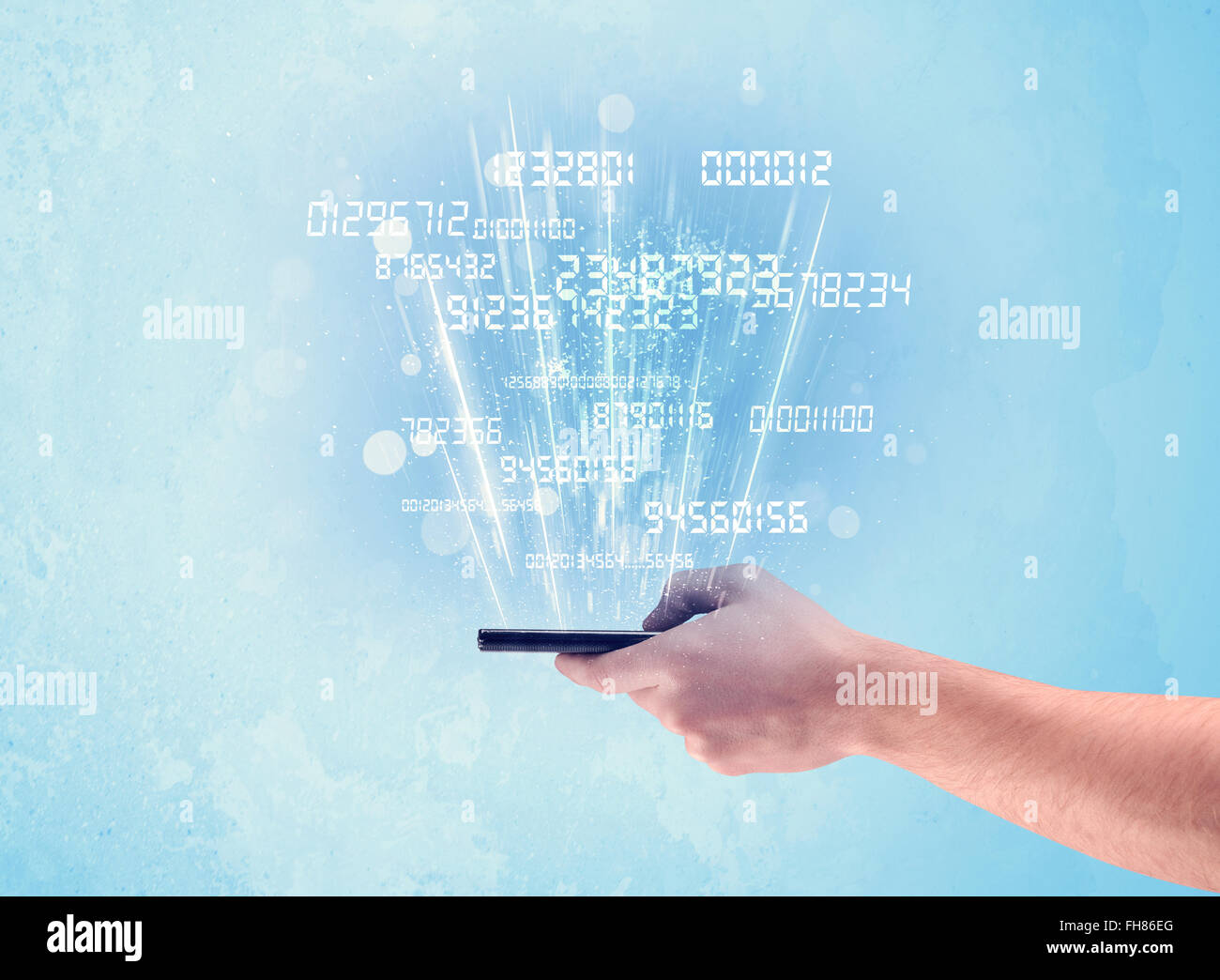 Hand holding phone with digital numbers Stock Photo - Alamy