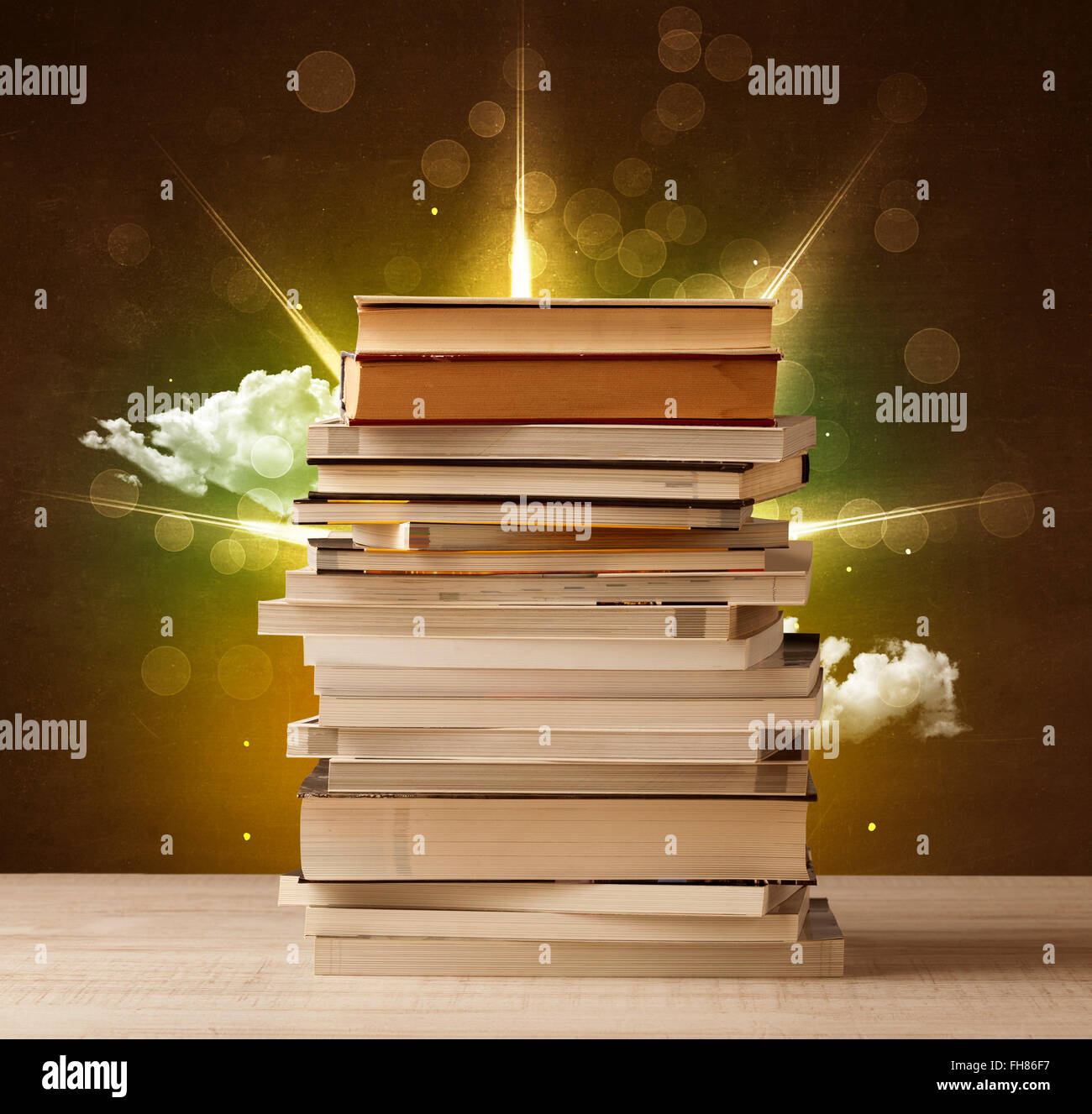 Magical books with ray of magical lights and colorful clouds Stock ...