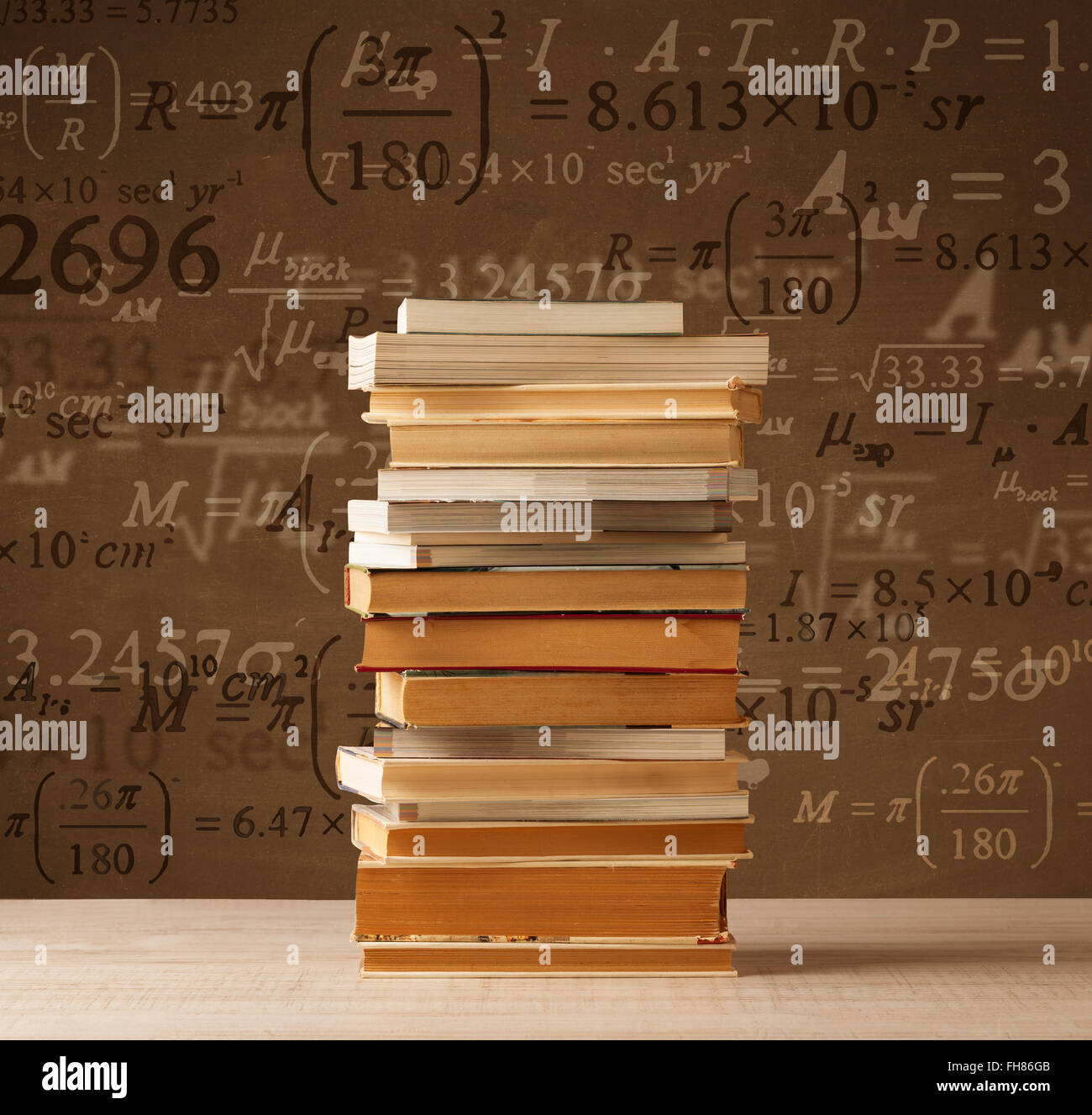 Books on vintage background with math formulas Stock Photo - Alamy