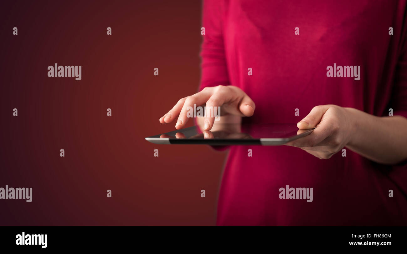 Close up of hand holding digital touchpad tablet device Stock Photo - Alamy
