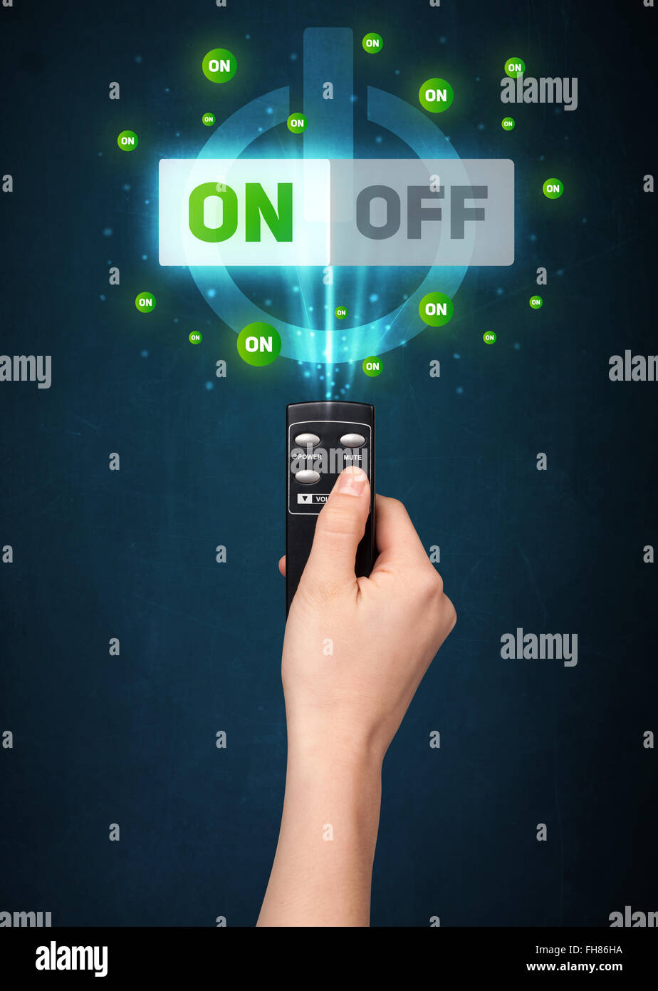 Hand with remote control and on-off signals Stock Photo - Alamy