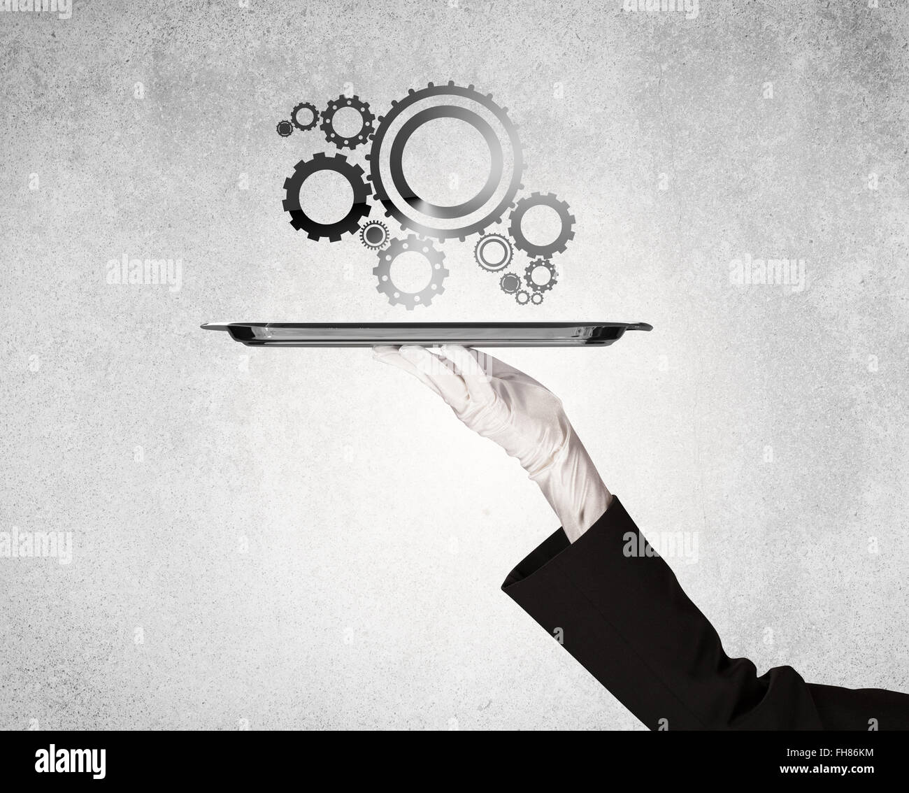 Working cog wheel concept on tray Stock Photo - Alamy
