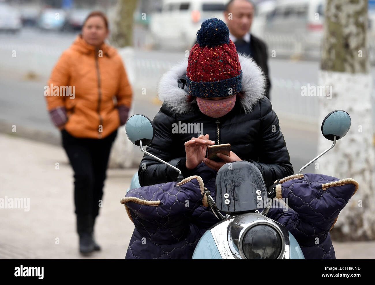 Kunming, China's Yunnan Province. 24th Feb, 2016. A woman wearing ...