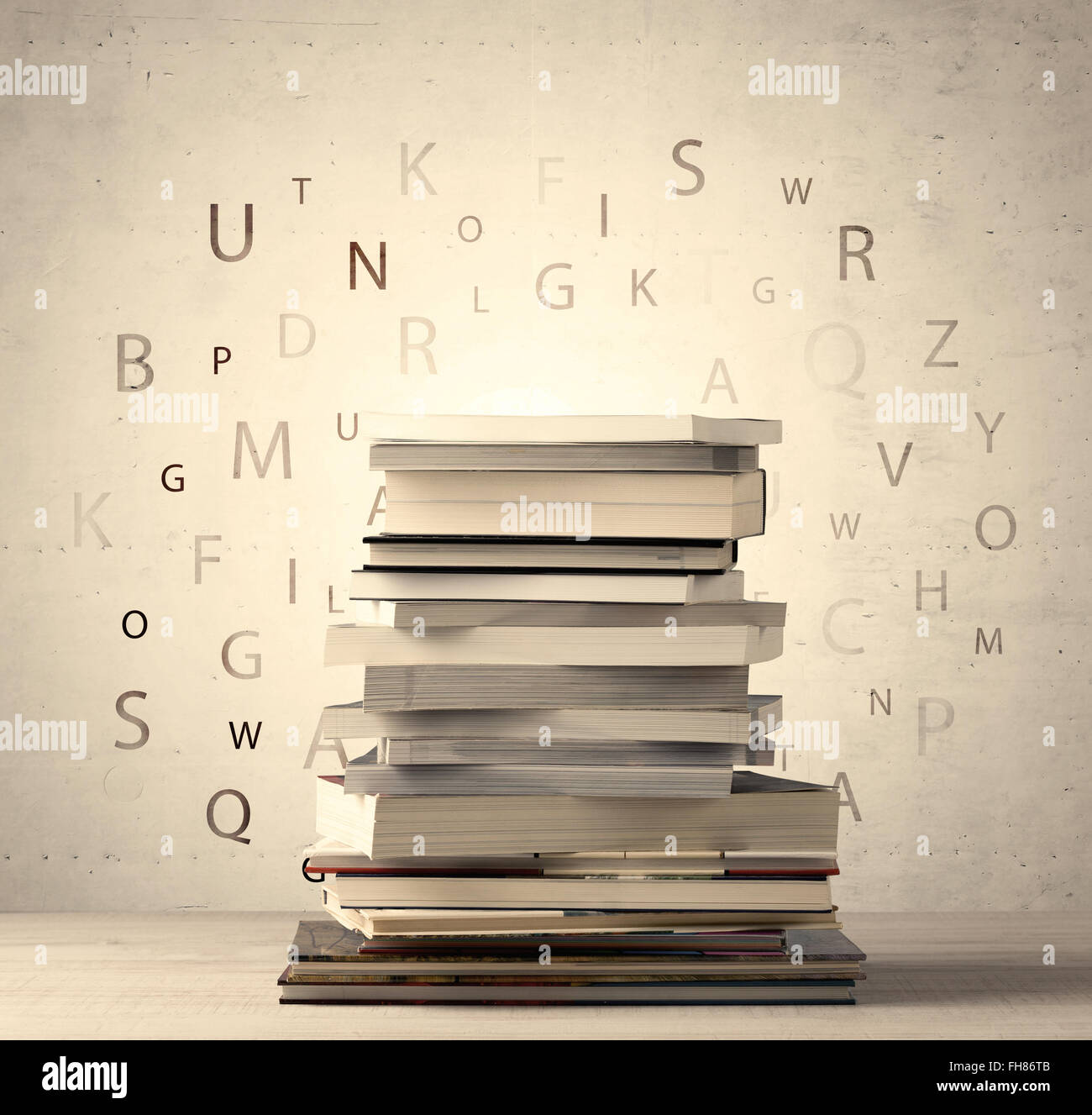 Books with flying letters on vintage background Stock Photo - Alamy