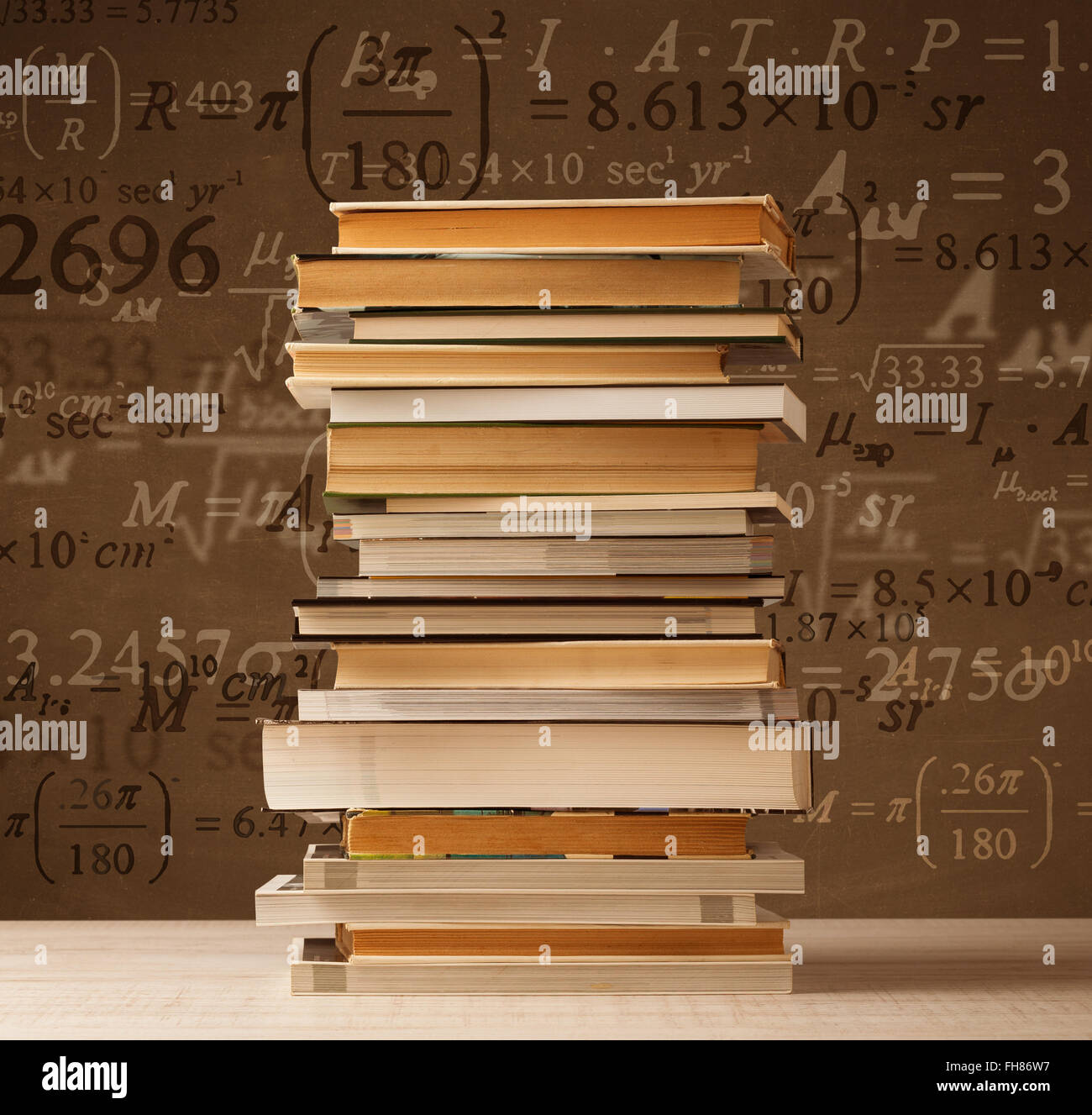 Books on vintage background with math formulas Stock Photo - Alamy