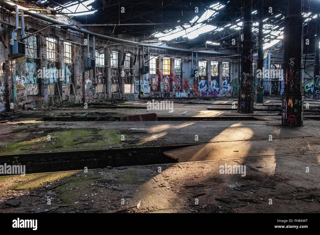 Derelict former freight railyard train shed interior and turntable ...