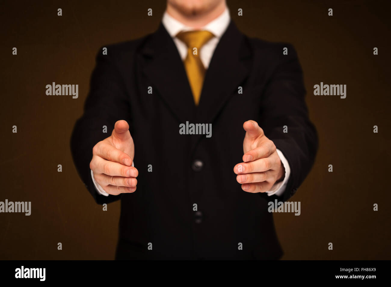 Businessman holding something Stock Photo - Alamy