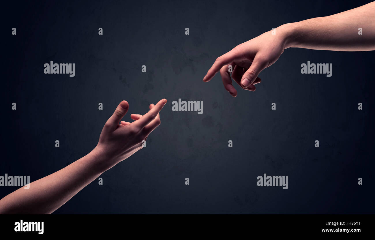 Hand about to touch another one Stock Photo - Alamy