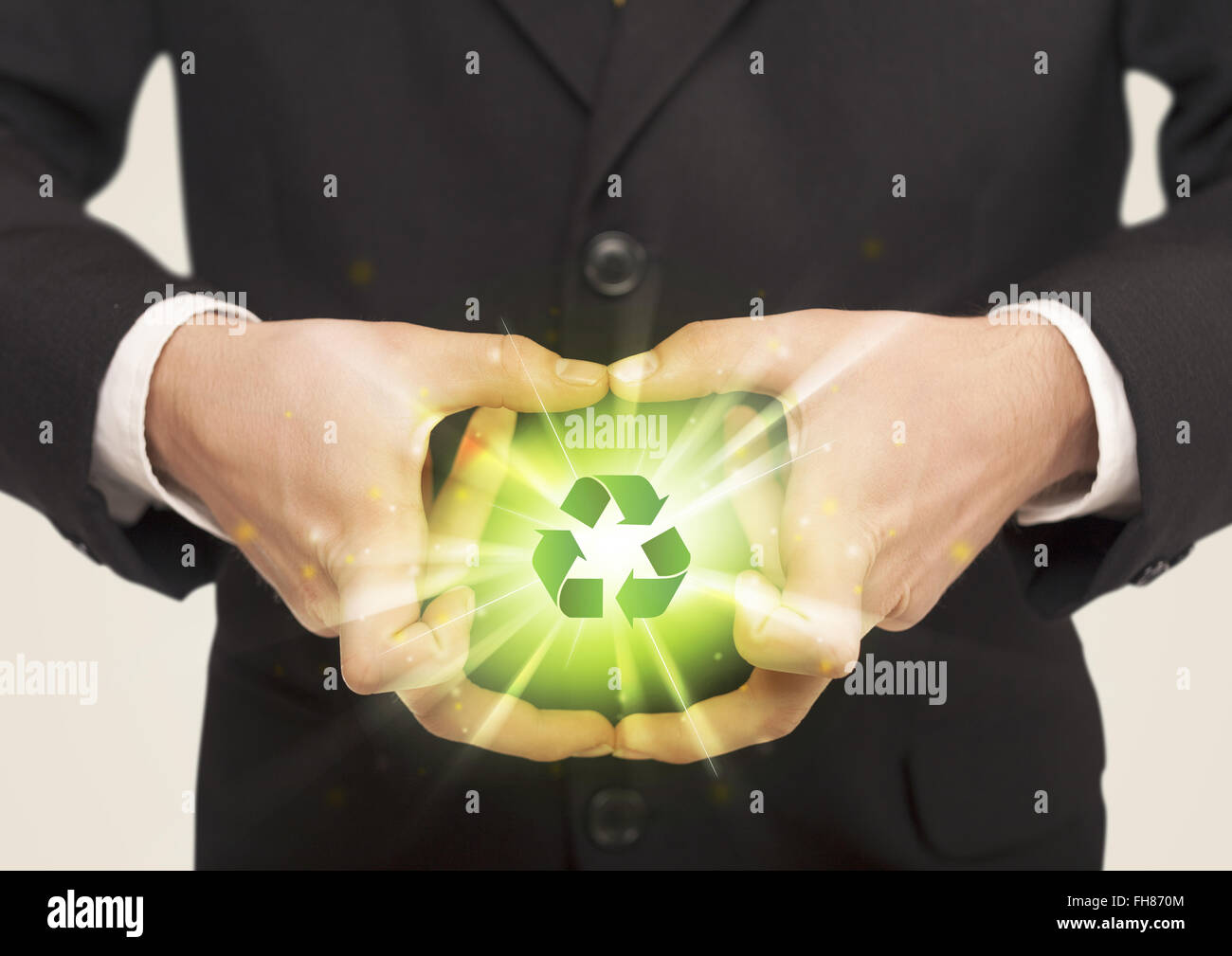 Hands creating a form with recycling sign Stock Photo - Alamy