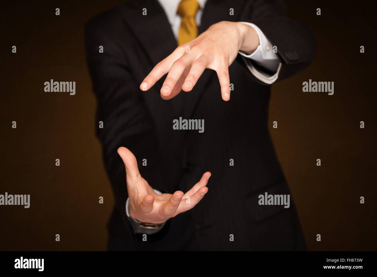 Businessman holding something Stock Photo - Alamy
