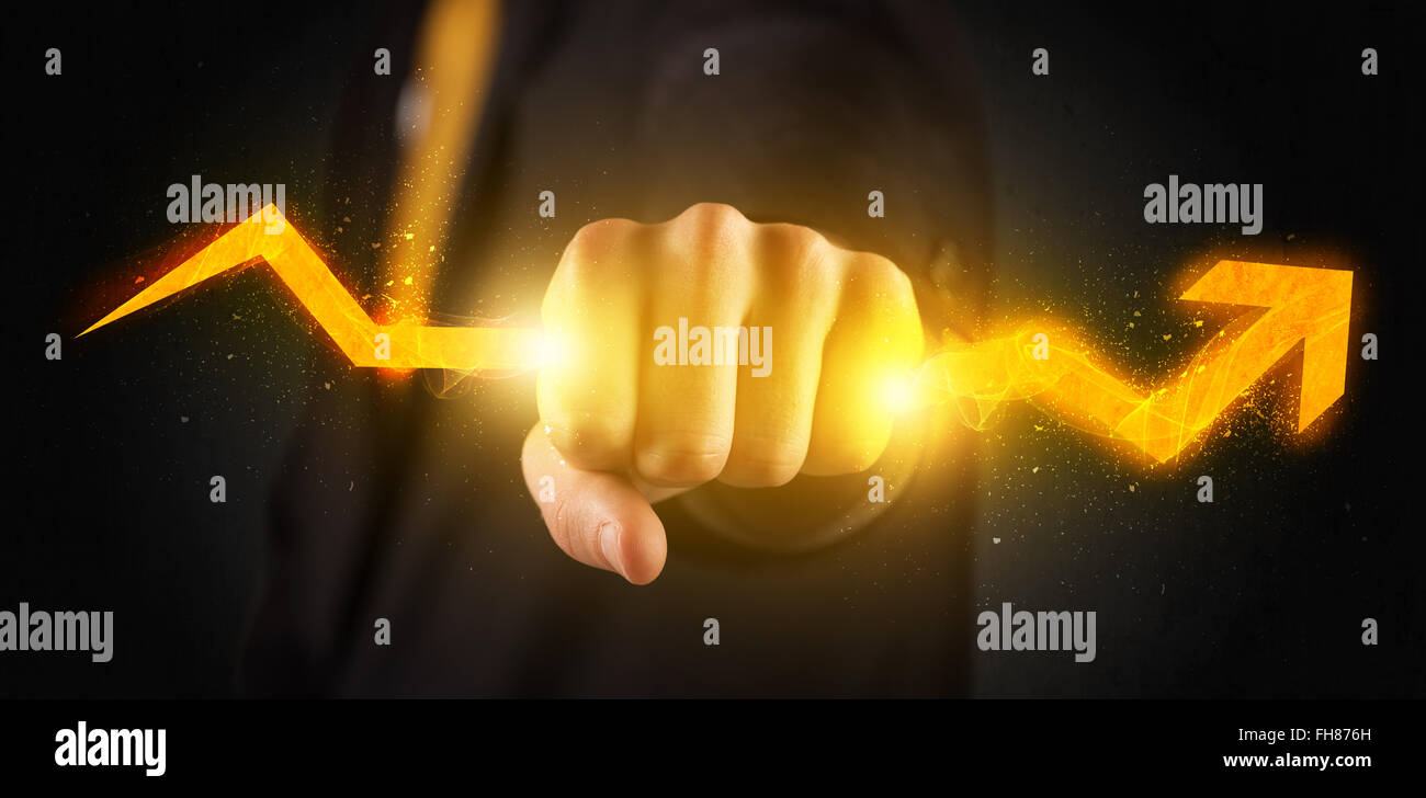 Business person holding a hot glowing upright arrow Stock Photo - Alamy