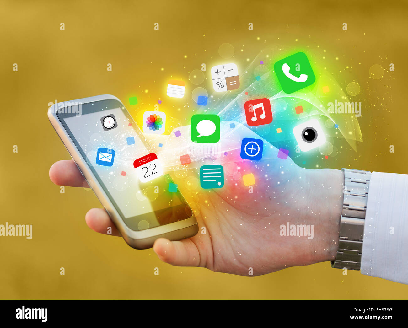 Hand holding smartphone with colorful app icons Stock Photo - Alamy