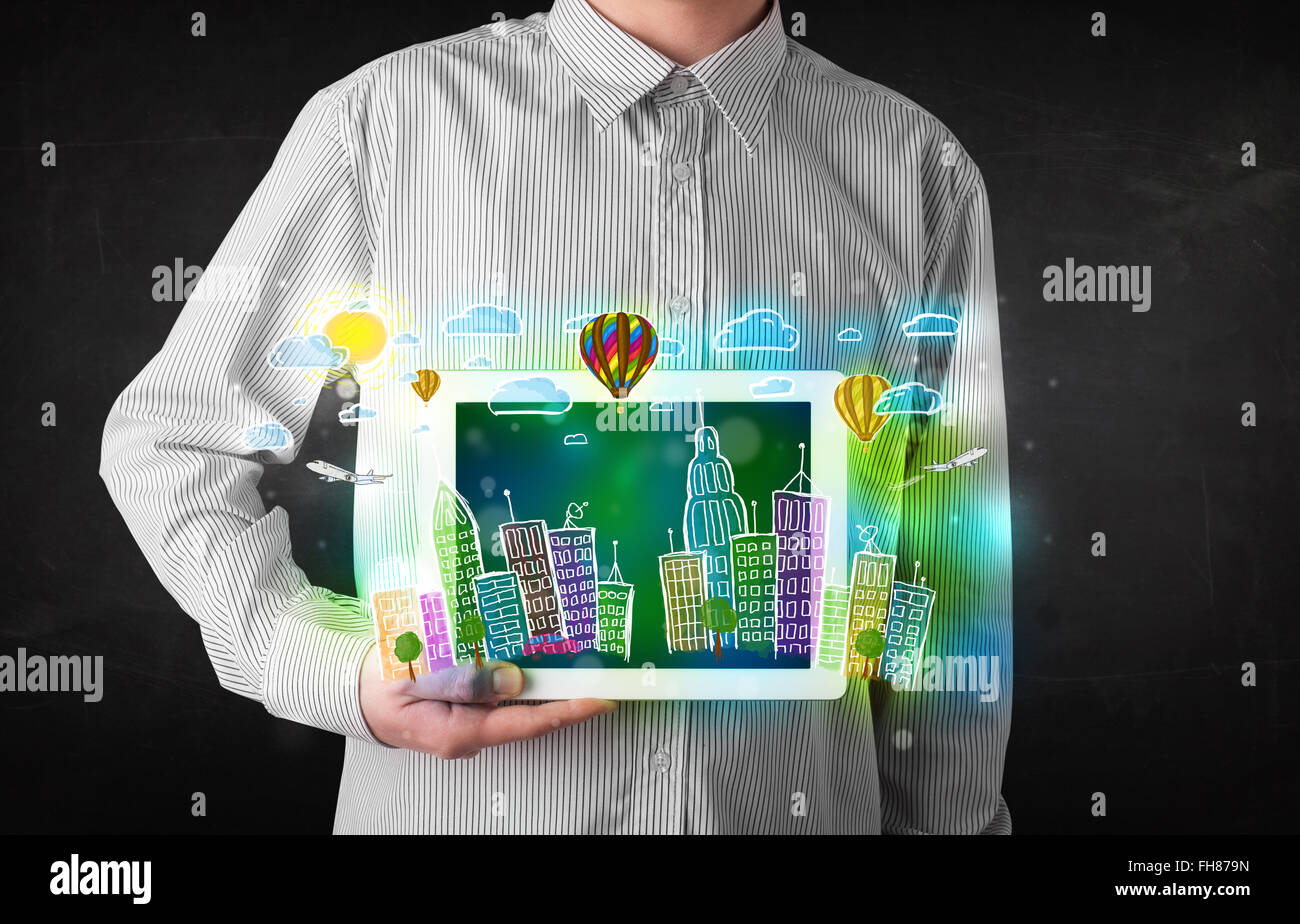 Young person showing tablet with hand drawn cityscape Stock Photo - Alamy