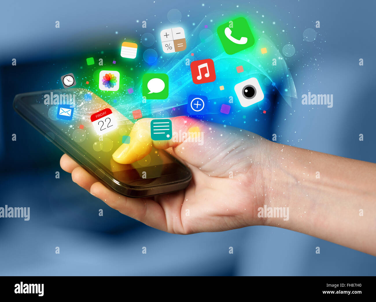 Hand holding smartphone with colorful app icons Stock Photo - Alamy