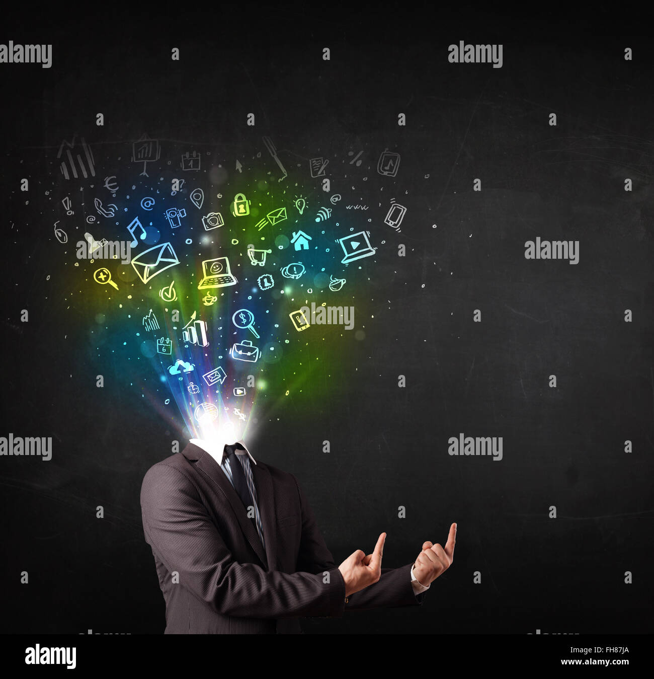 Business man with glowing media icons exploding head Stock Photo - Alamy