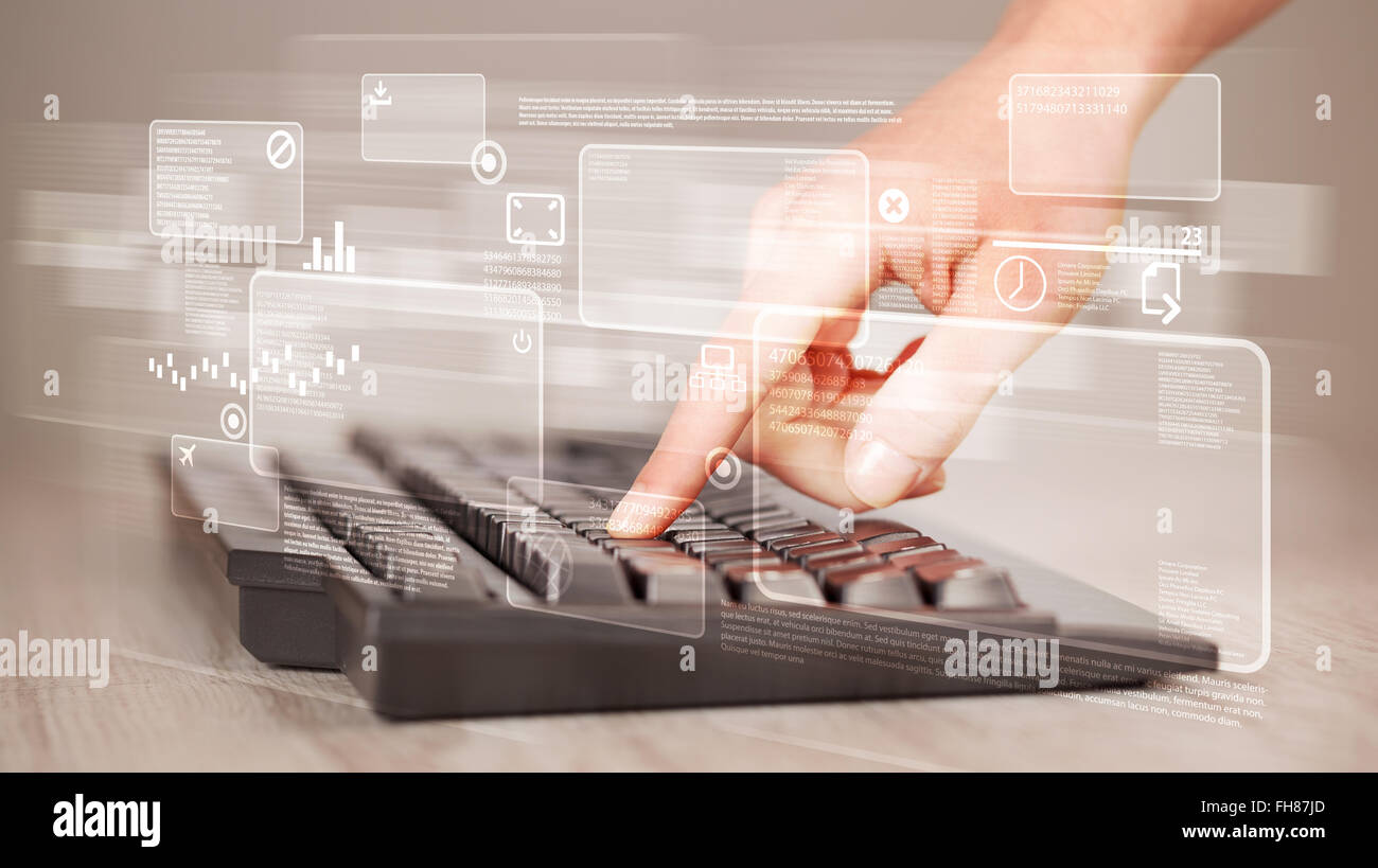 Hand touching keyboard with high tech buttons Stock Photo - Alamy