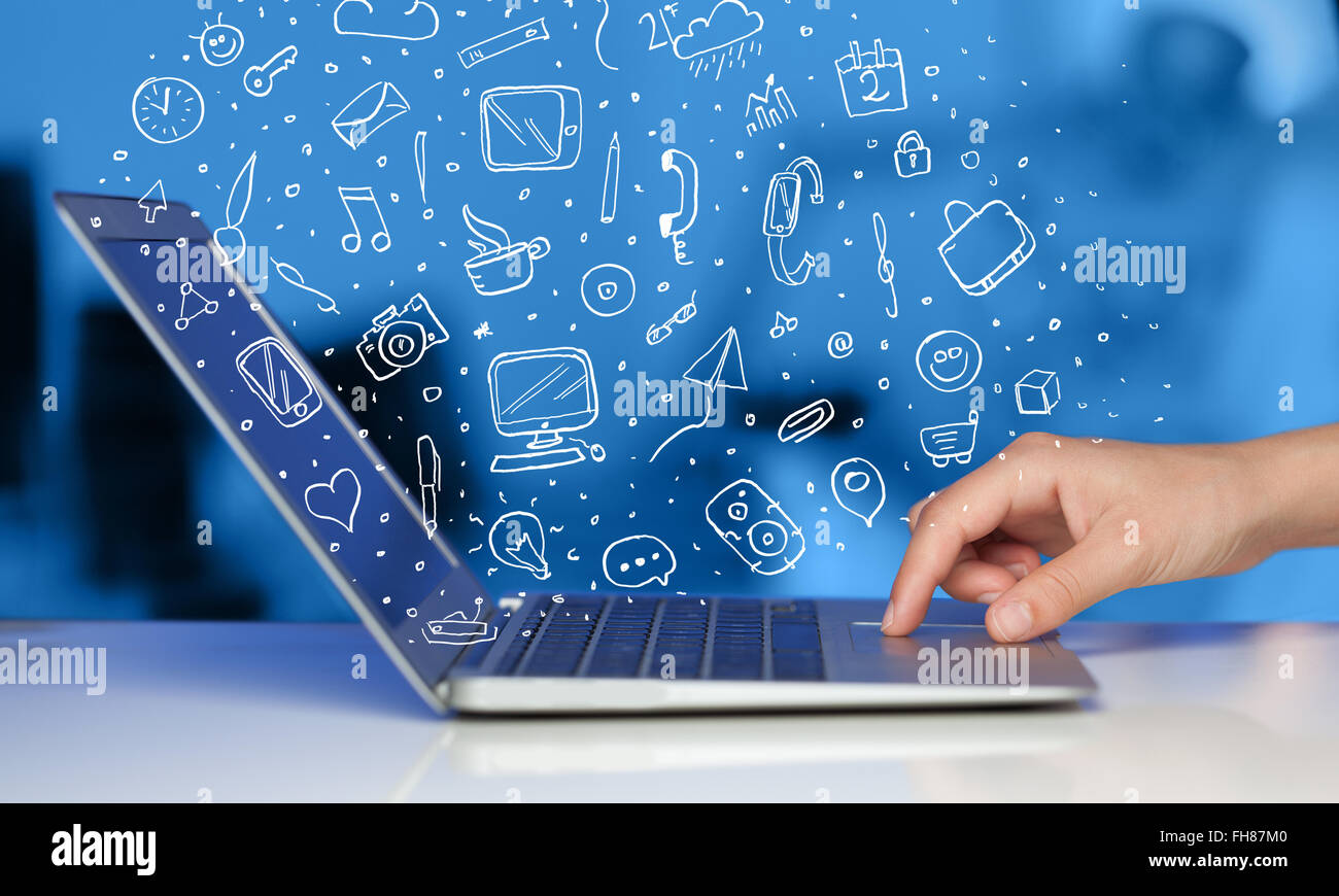 Laptop computer wtih hand drawn icons and symbols Stock Photo - Alamy