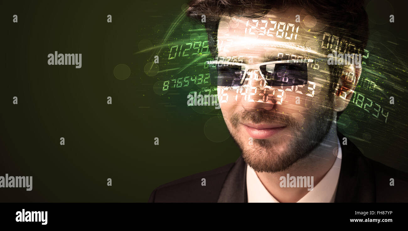 Business man looking at high tech number calculations Stock Photo - Alamy