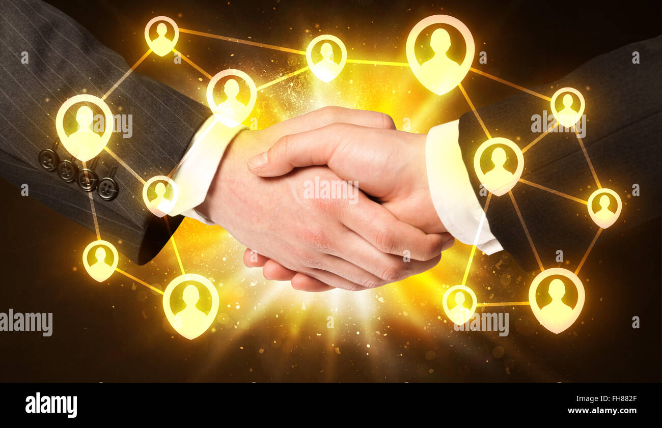 Social netwok connection handshake Stock Photo - Alamy