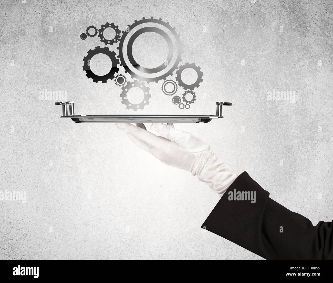 Working cog wheel concept on tray Stock Photo - Alamy