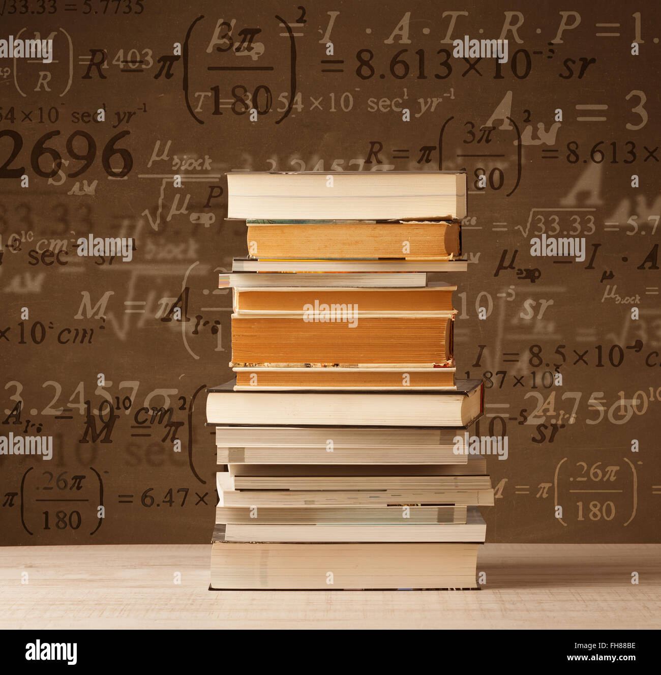 Books on vintage background with math formulas Stock Photo - Alamy