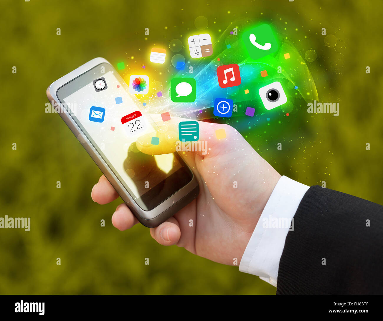 Hand holding smartphone with colorful app icons Stock Photo - Alamy