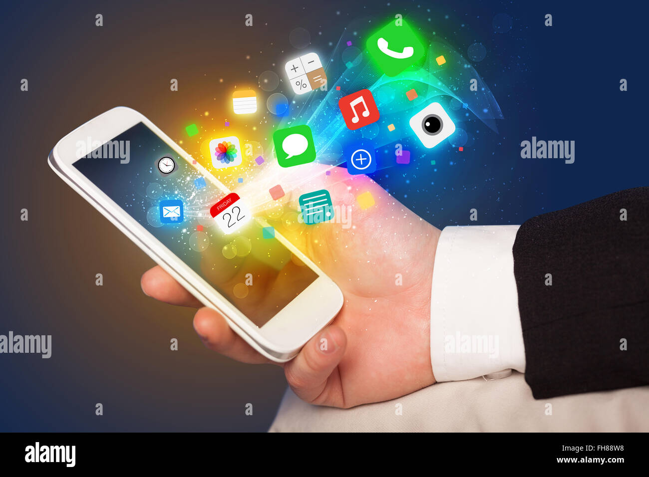 Hand holding smartphone with colorful app icons Stock Photo - Alamy