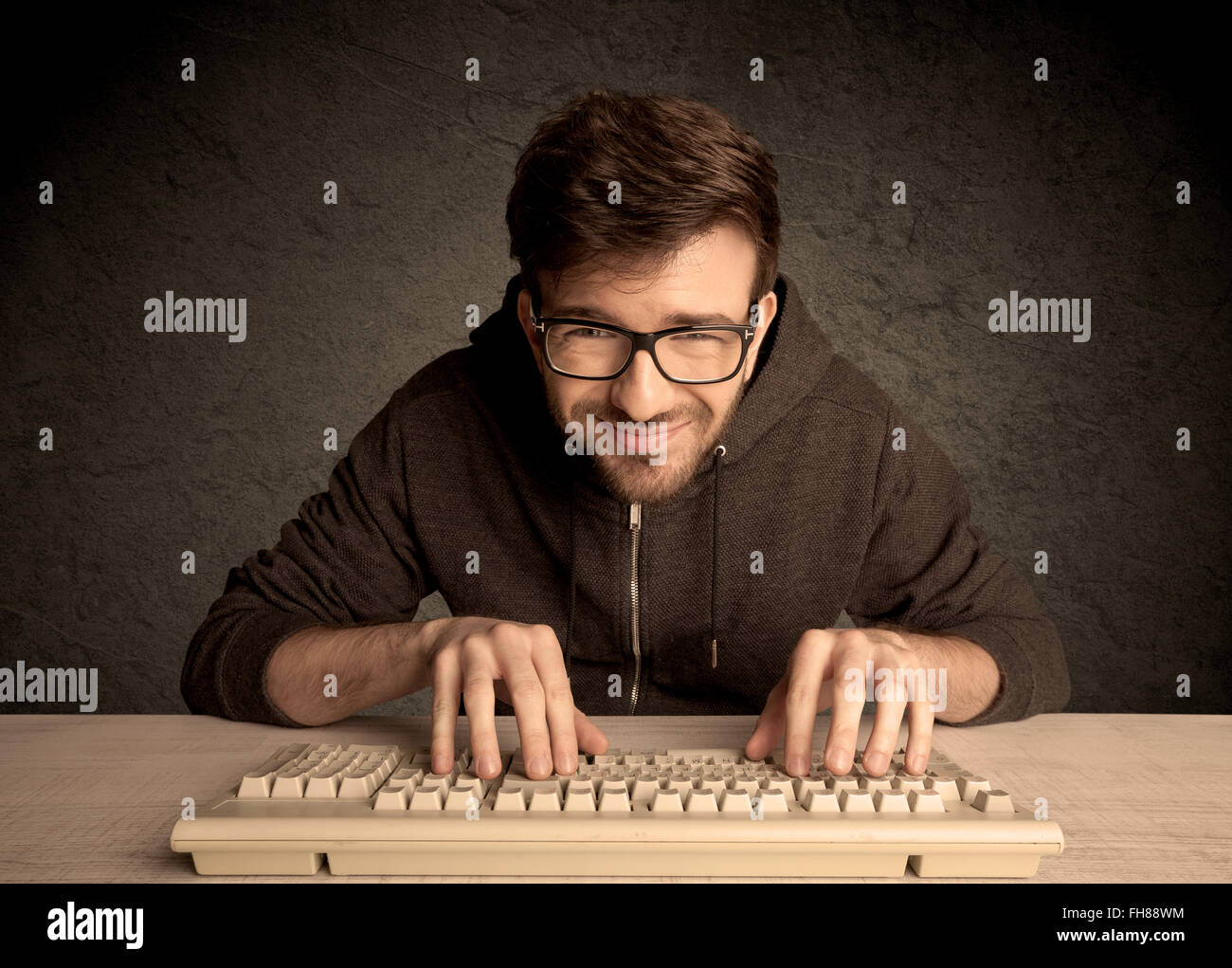 Computer geek typing on keyboard Stock Photo - Alamy