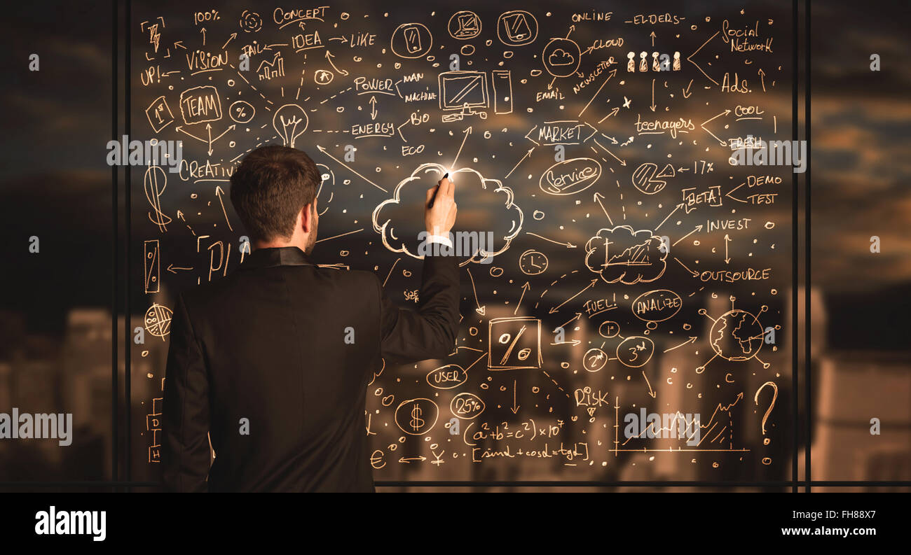 Businessman drawing business plan Stock Photo - Alamy