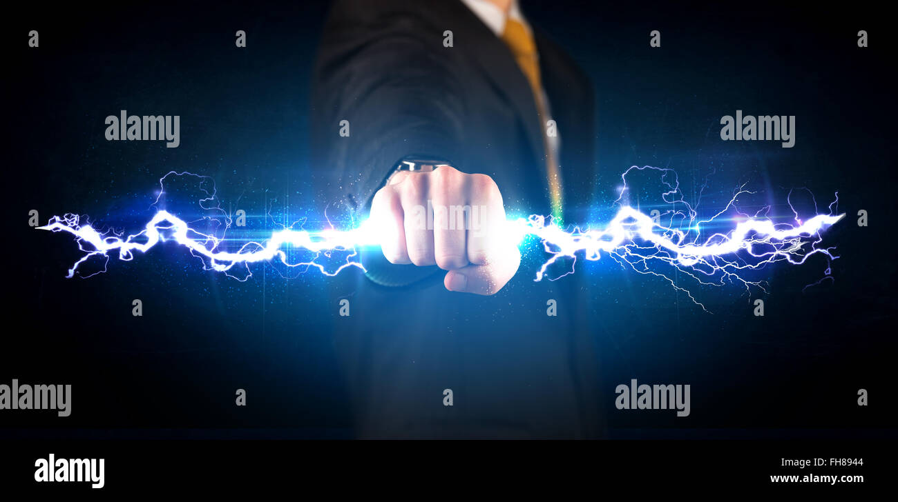 Business man holding electricity light bolt in his hands Stock Photo ...