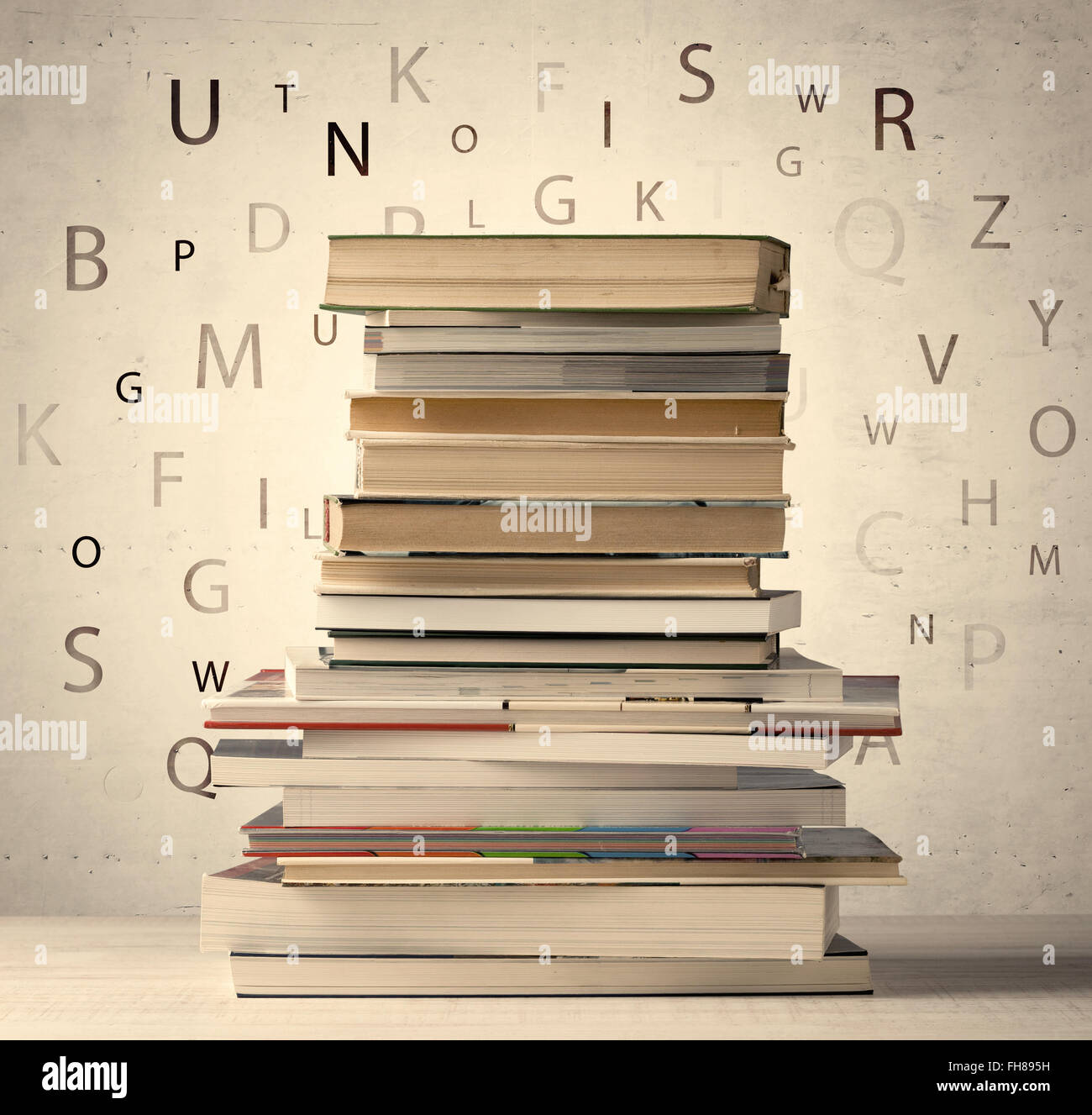 Books with flying letters on vintage background Stock Photo - Alamy