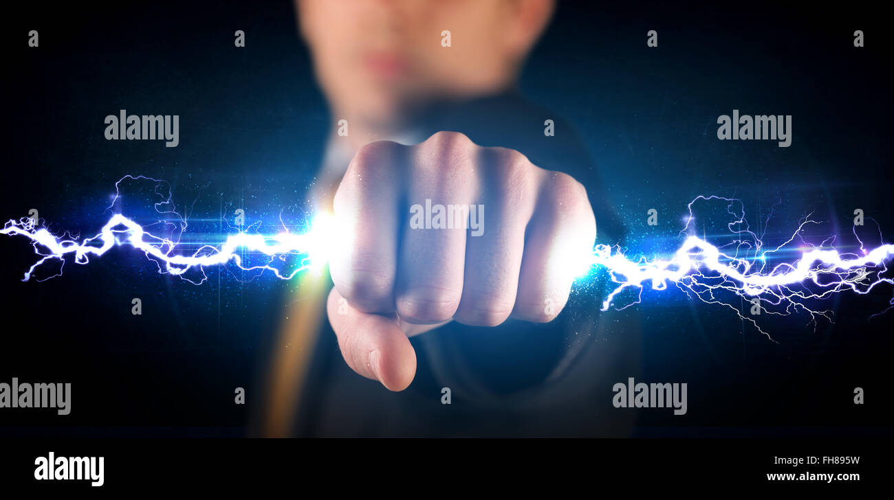 Business man holding electricity light bolt in his hands Stock Photo ...
