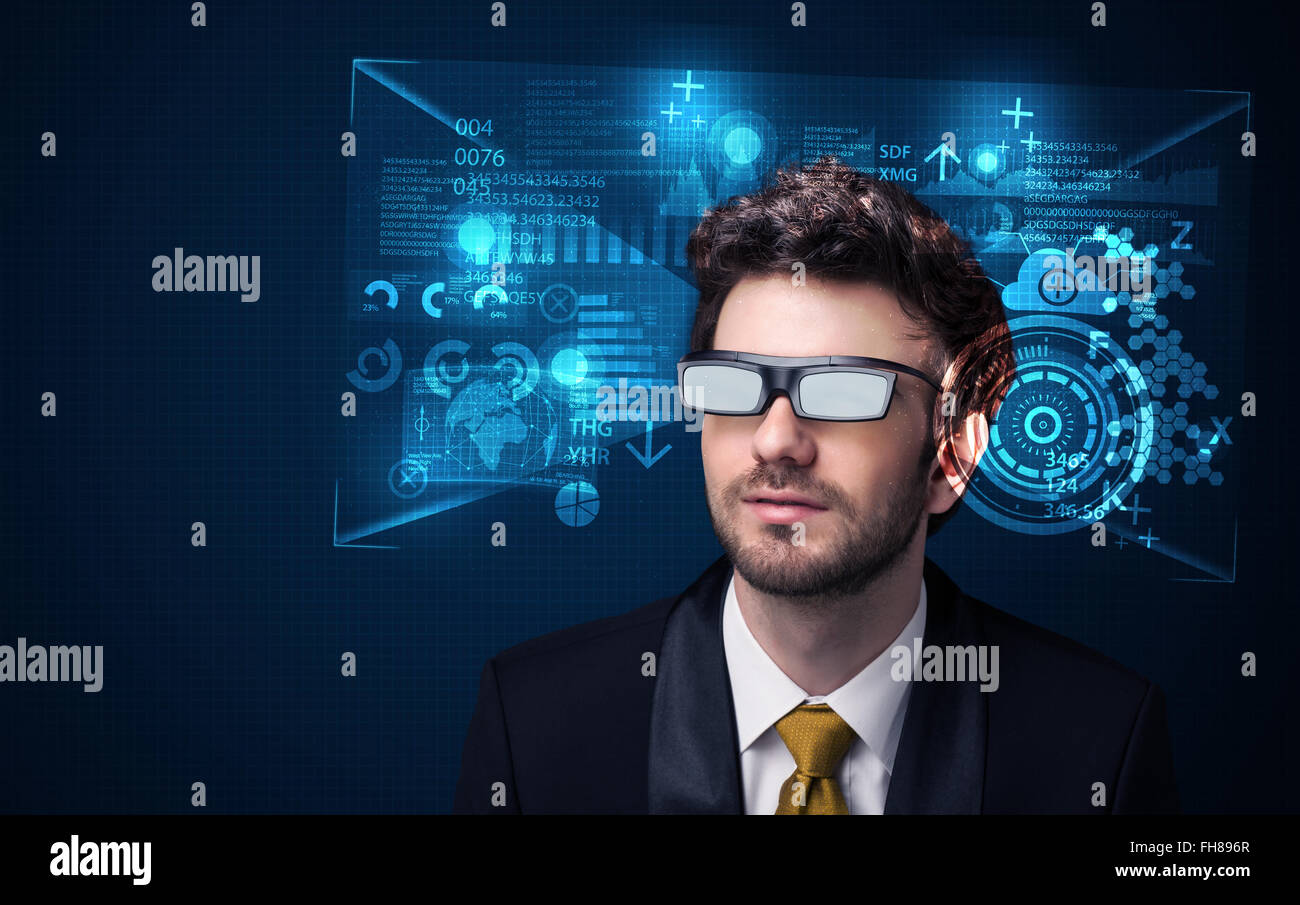 Young man looking with futuristic smart high tech glasses Stock Photo ...