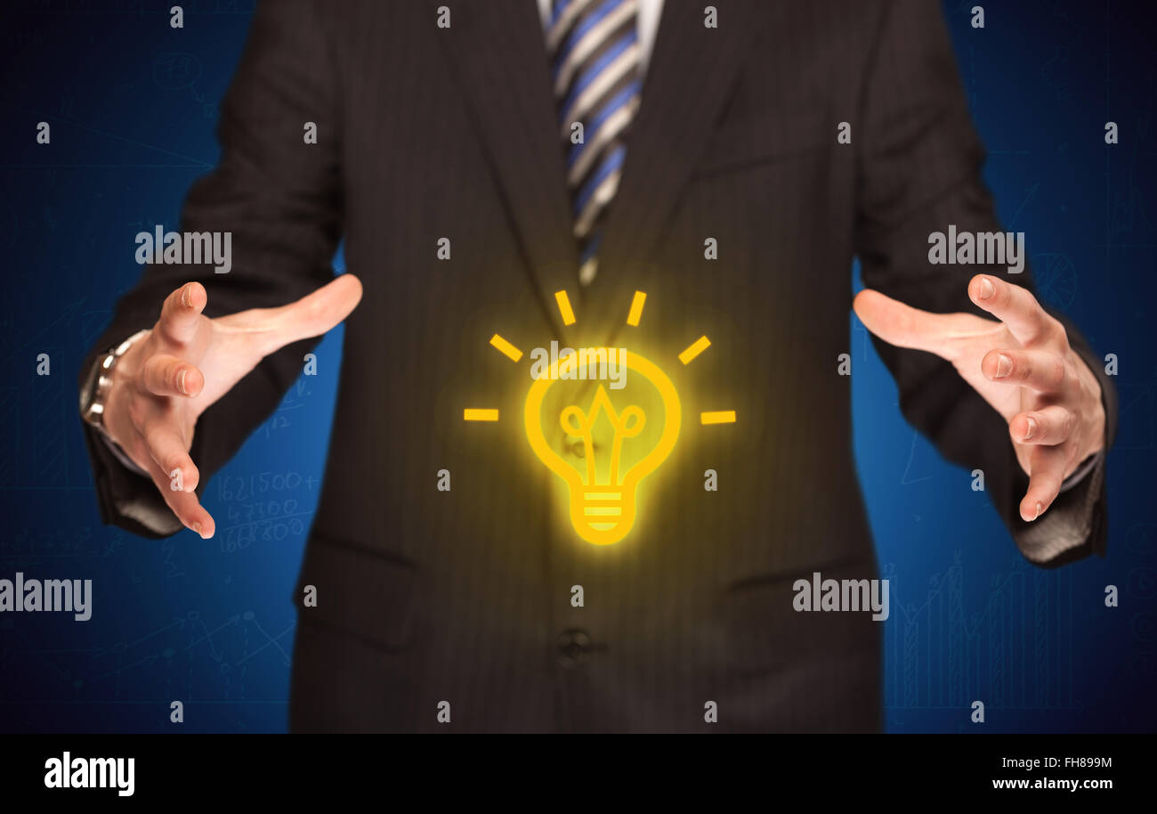 Sales guy has bright idea in the hand Stock Photo - Alamy